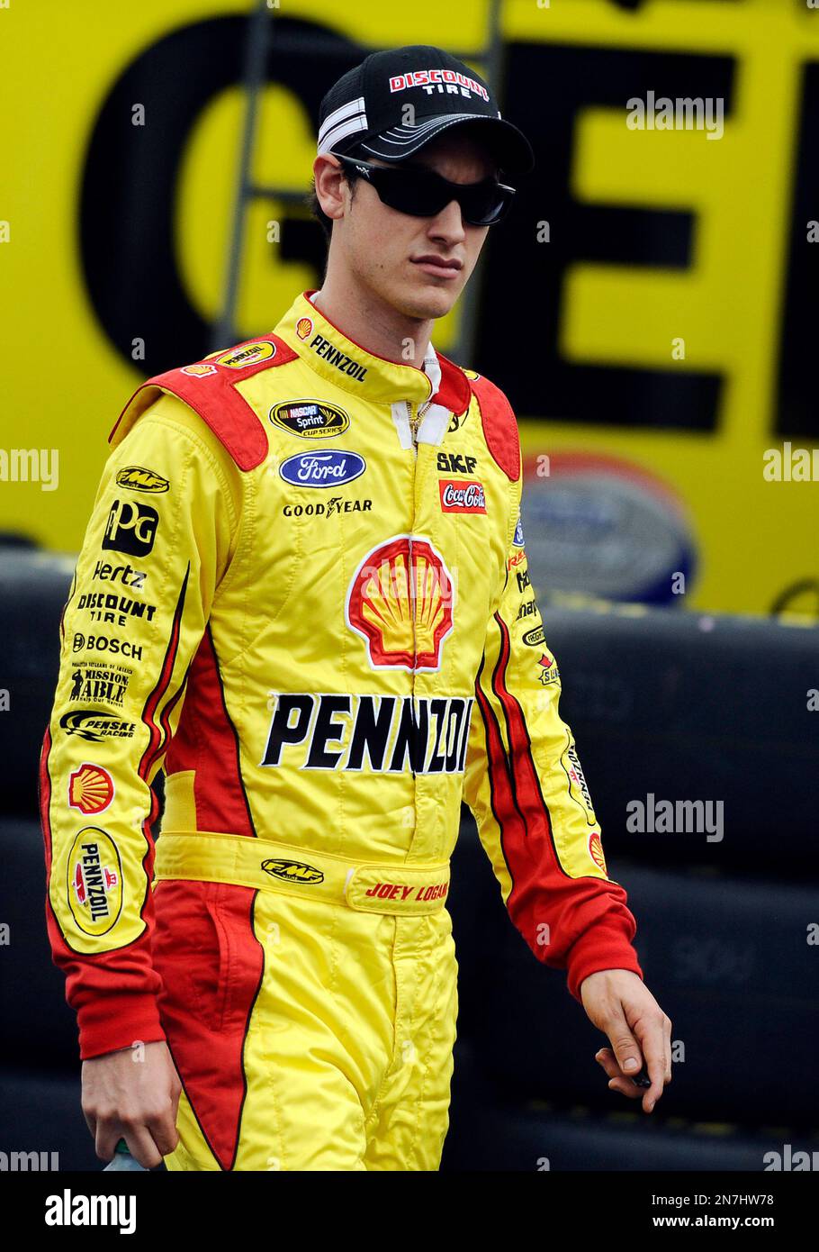 NASCAR Sprint Cup series driver Joey Logano walks in the garage area ...
