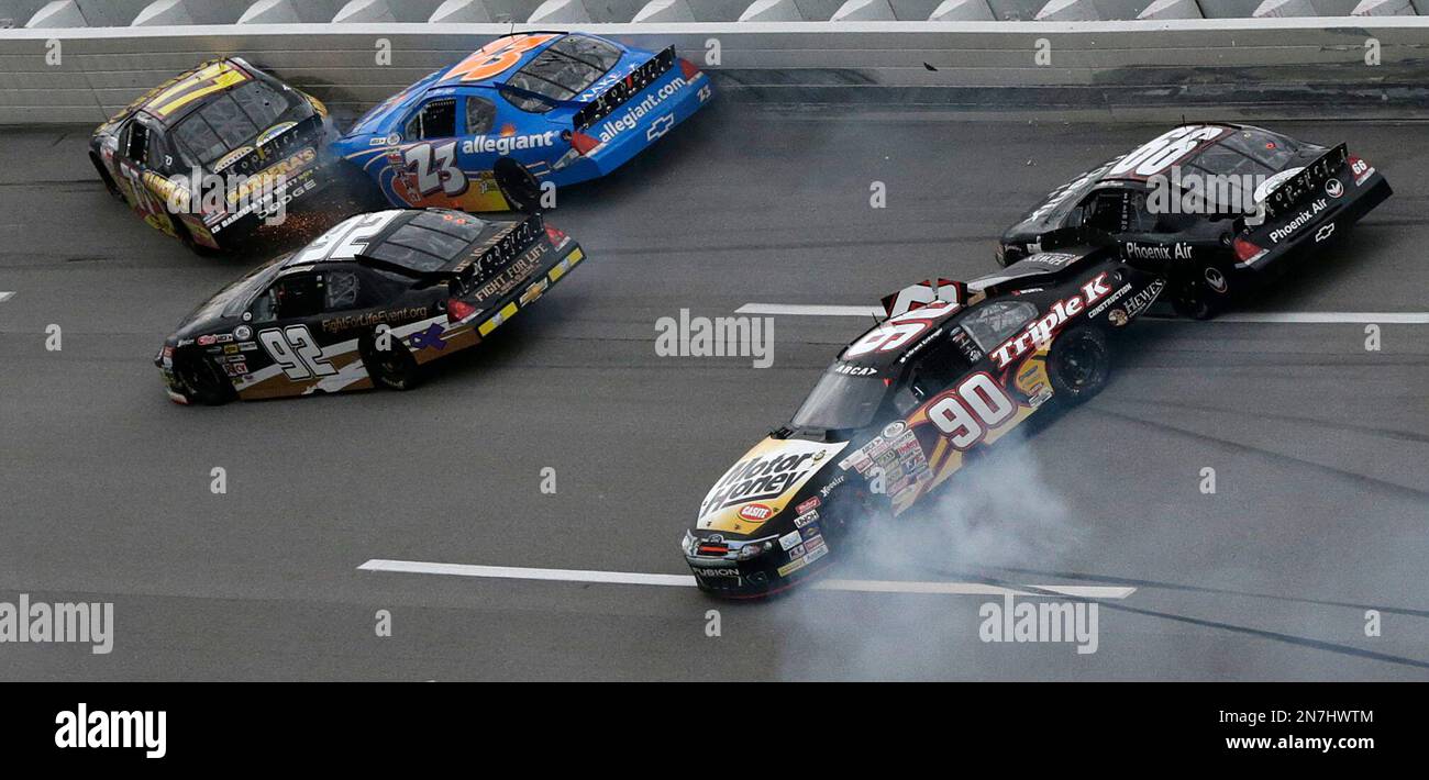 Cars spin through turn 2 during a crash in the ARCA series auto race at ...