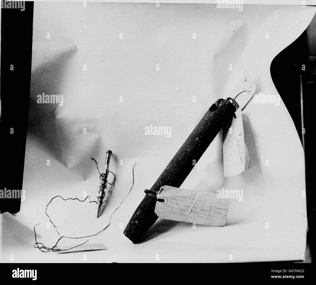 The sash-weight, picture wire and gold pencil, which were used to ...