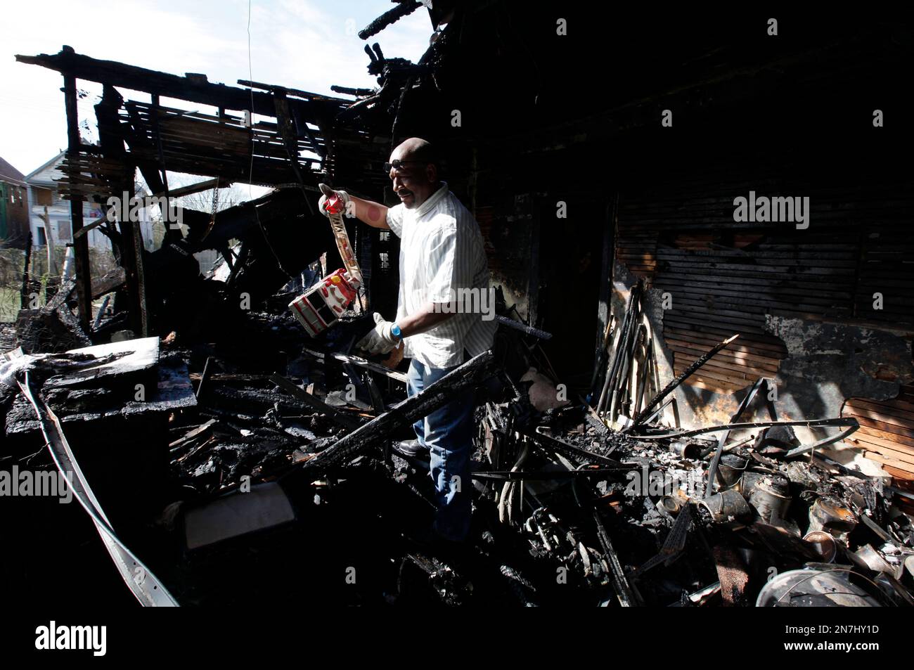 Tyree Guyton, creator of the Heidelberg Project, finds a toy while ...