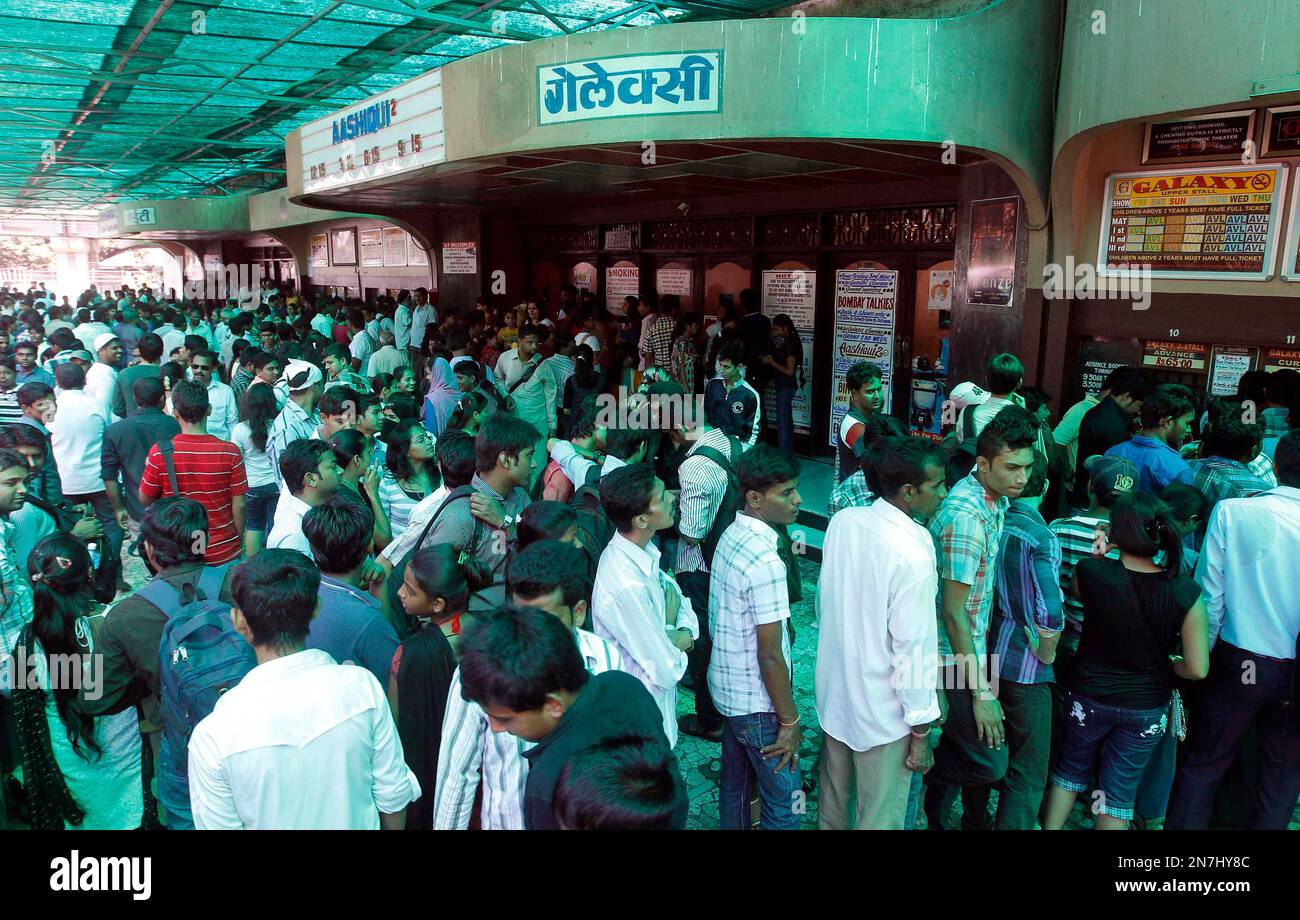 Indians crowd outside a movie theater in Mumbai, India, Friday, May 3 ...