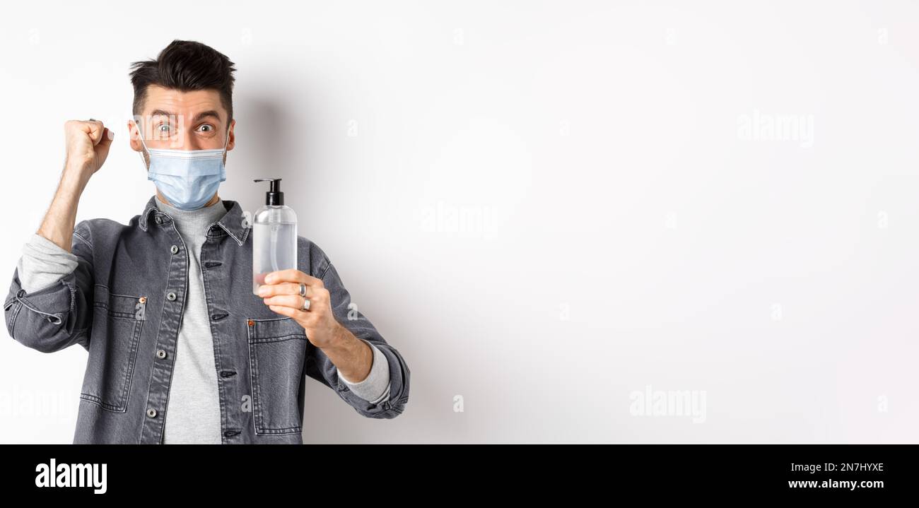 Health, covid and pandemic concept. Happy guy motivated to get rid from ...