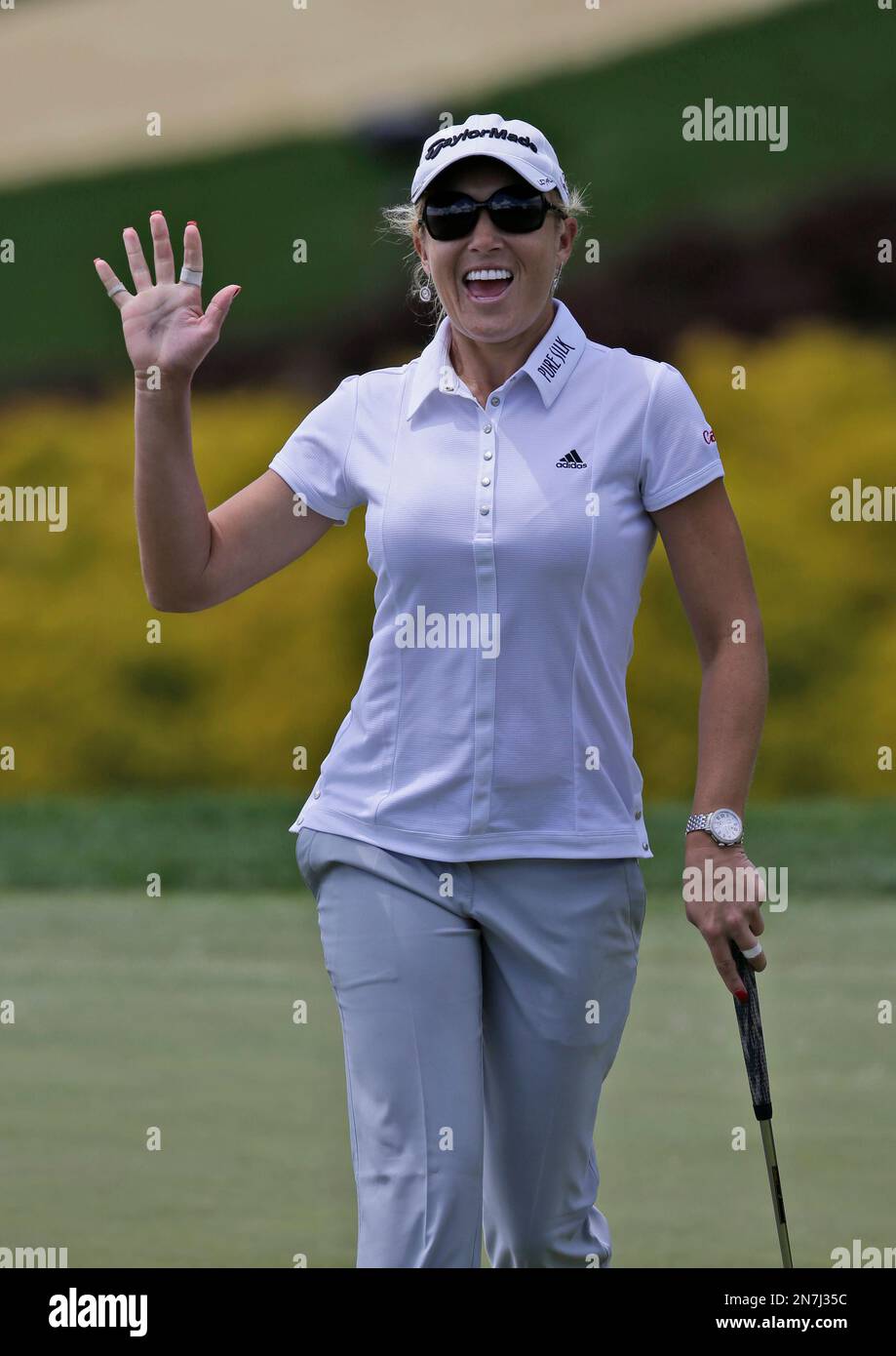 Natalie Gulbis waves to the crowd after her first round of the ...