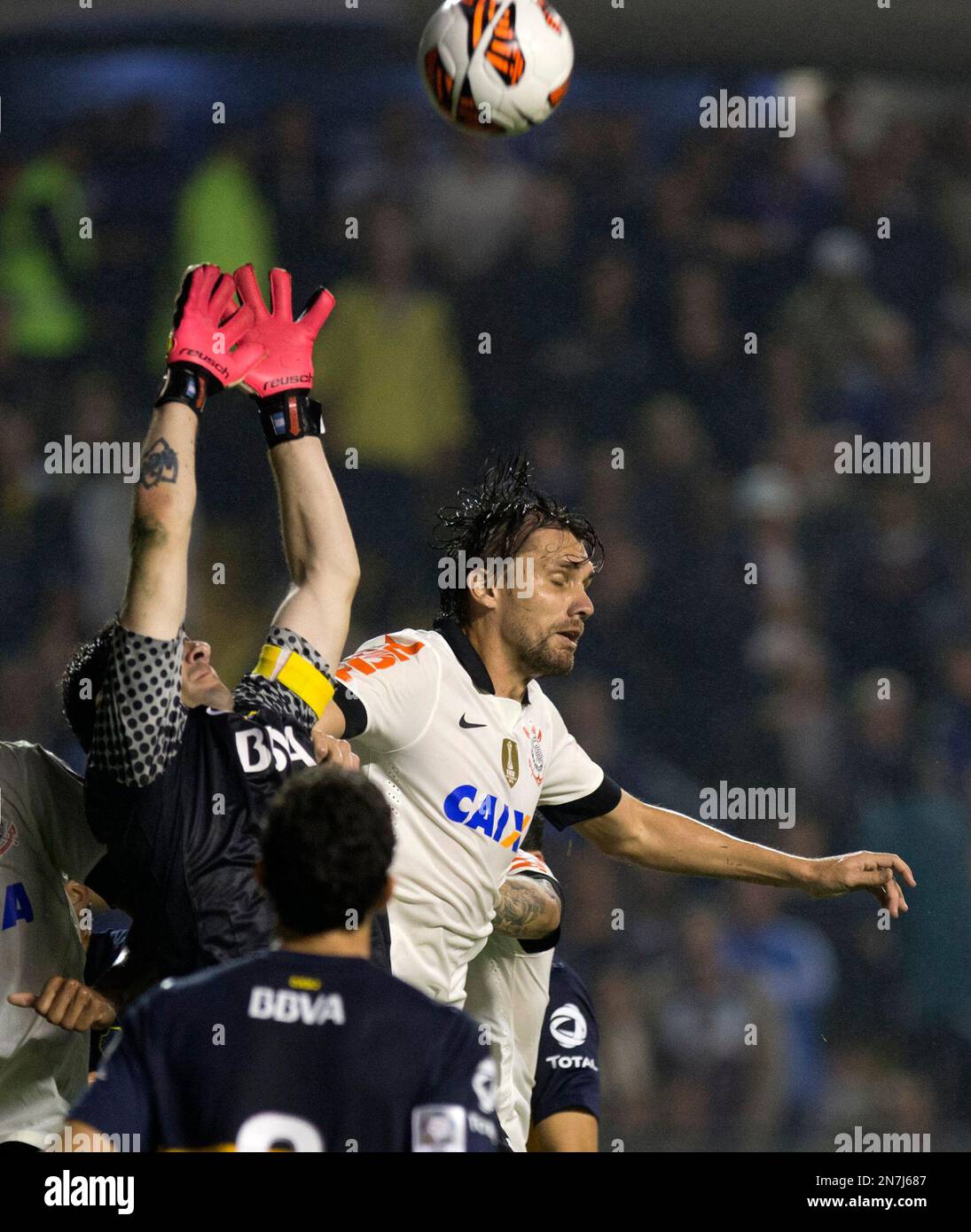 Argentina's Boca Juniors goalkeeper Agustin Orion, left, reaches up for ...