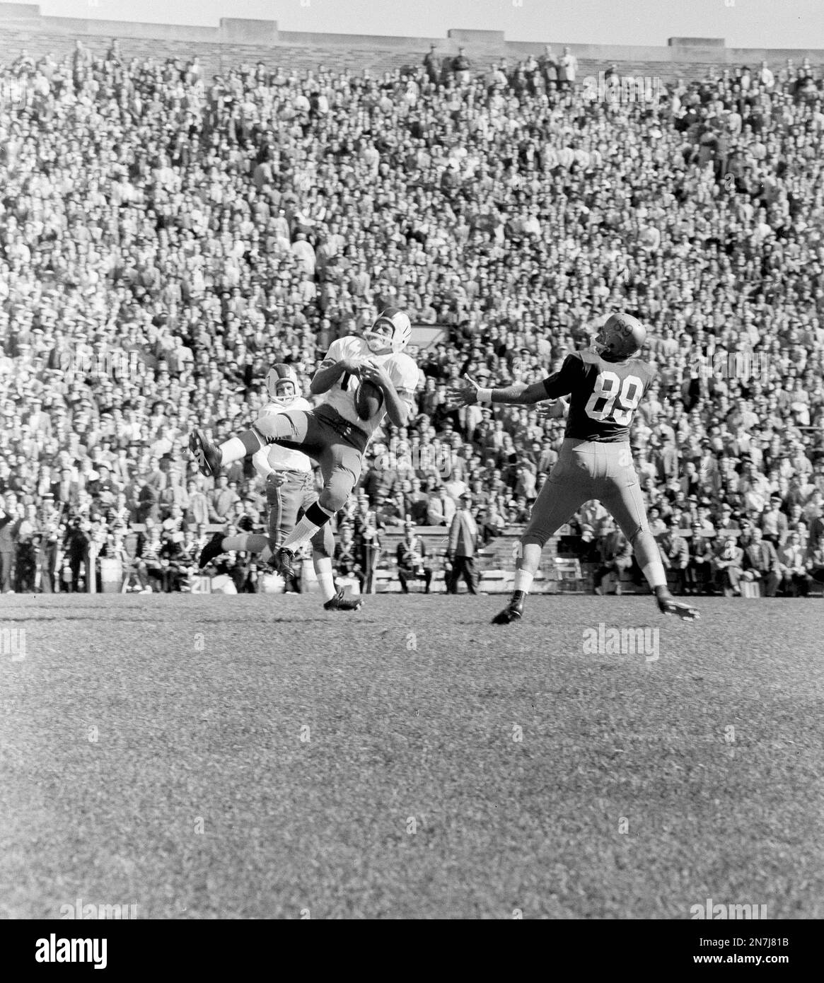 A catch puts the ball into the hands of Duke University quarterback Bob ...