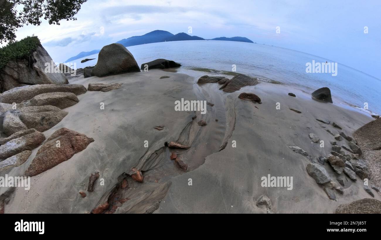 huge boulders laying along the sandy beach Stock Photo - Alamy