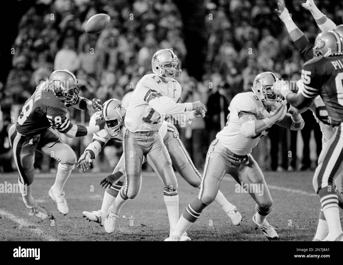 Dallas Cowboys quarterback Danny White (11) loses the ball after he was ...