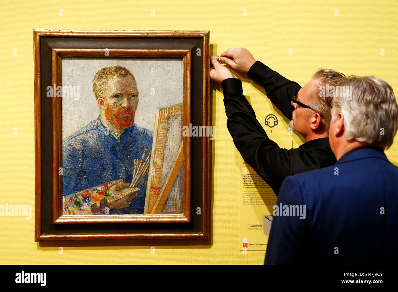 Curators hang an 1888 self-portrait of Vincent Van Gogh in which he ...