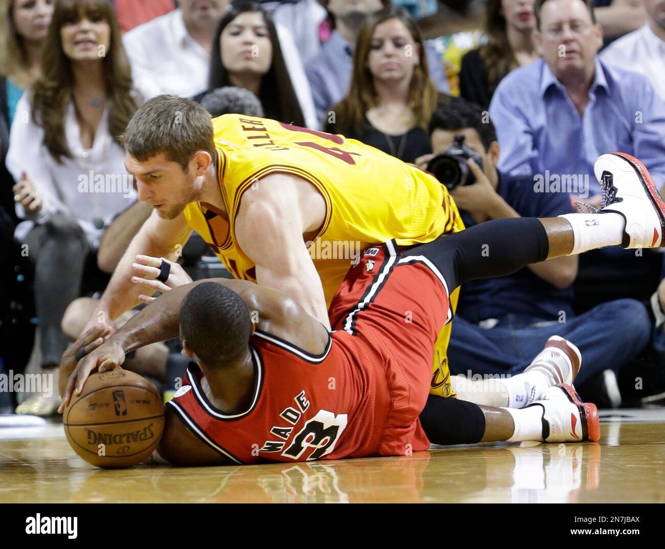 Cleveland Cavaliers center Tyler Zeller, top, and Miami Heat guard ...