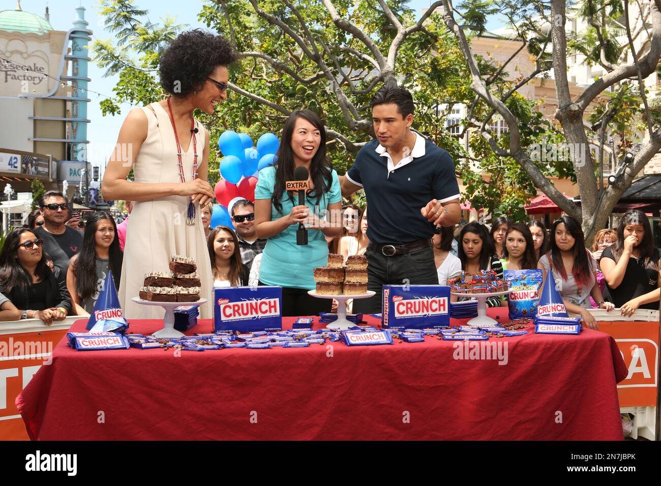 Carla Hall, left, and Mario Lopez, right, reveal the winning treat ...