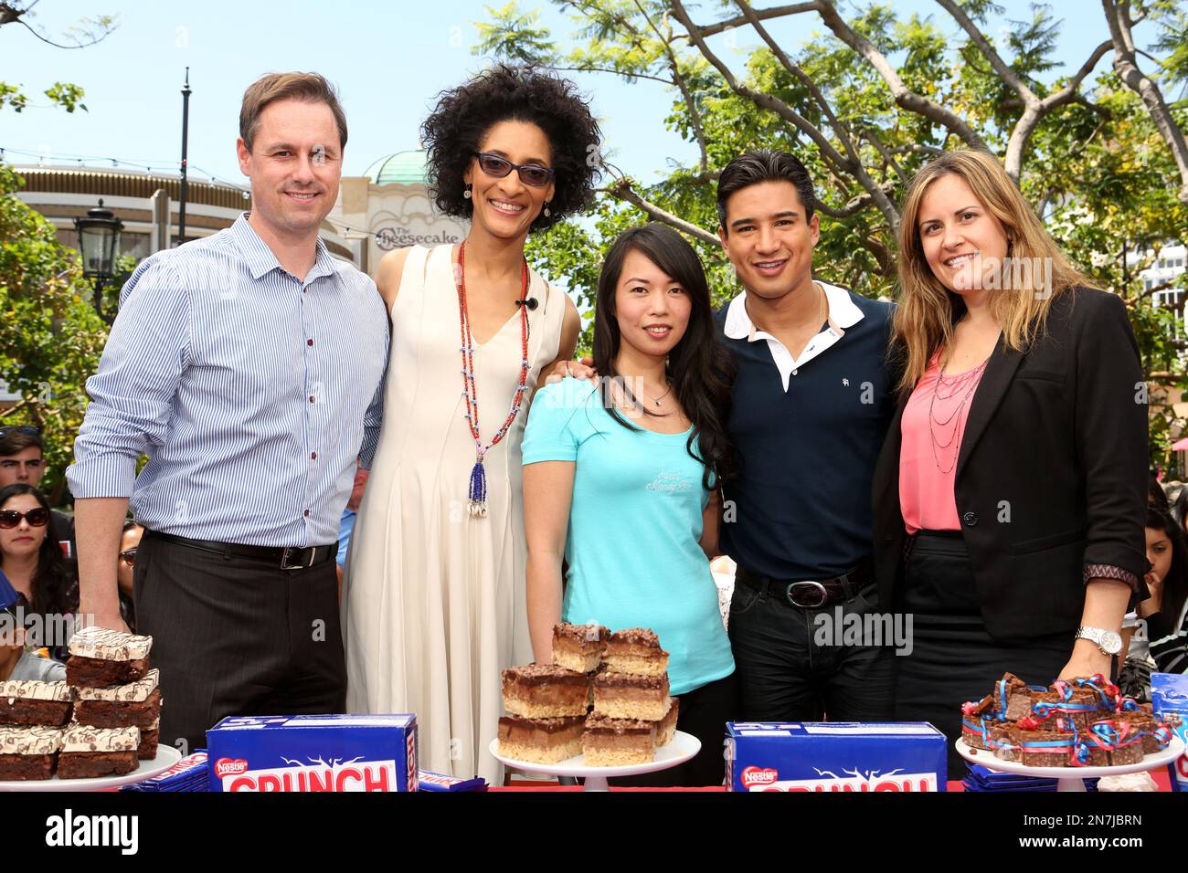 From left, Nestle Crunch's Matthew Biggins, Carla Hall, winner Sherrie ...