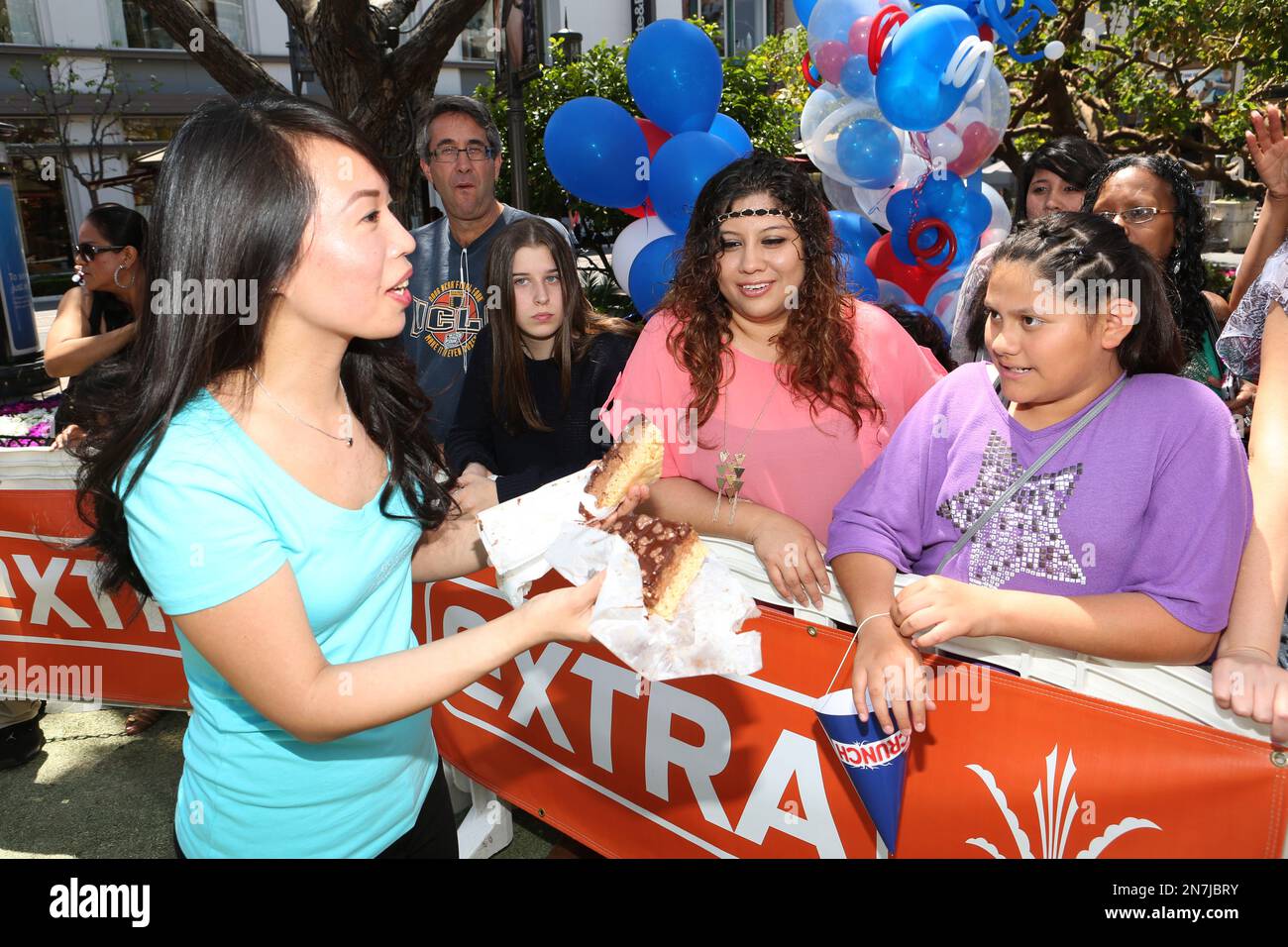 Sherrie Tan, left, of Sweet Mandy B's, hands out her winning treats at ...