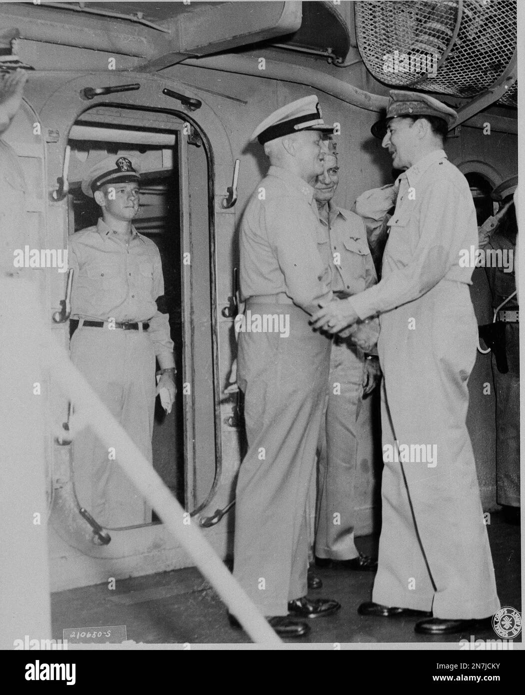 Adm. William F. Halsy, center, looks on aboard the USS Buchanan in ...