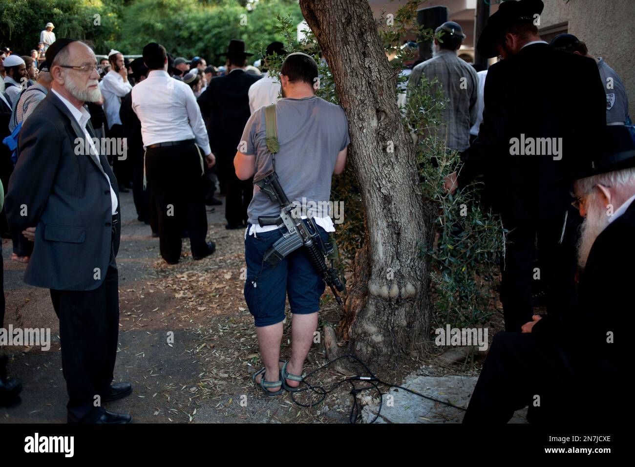 Family and friends attend the funeral of Israeli settler Eviatar ...