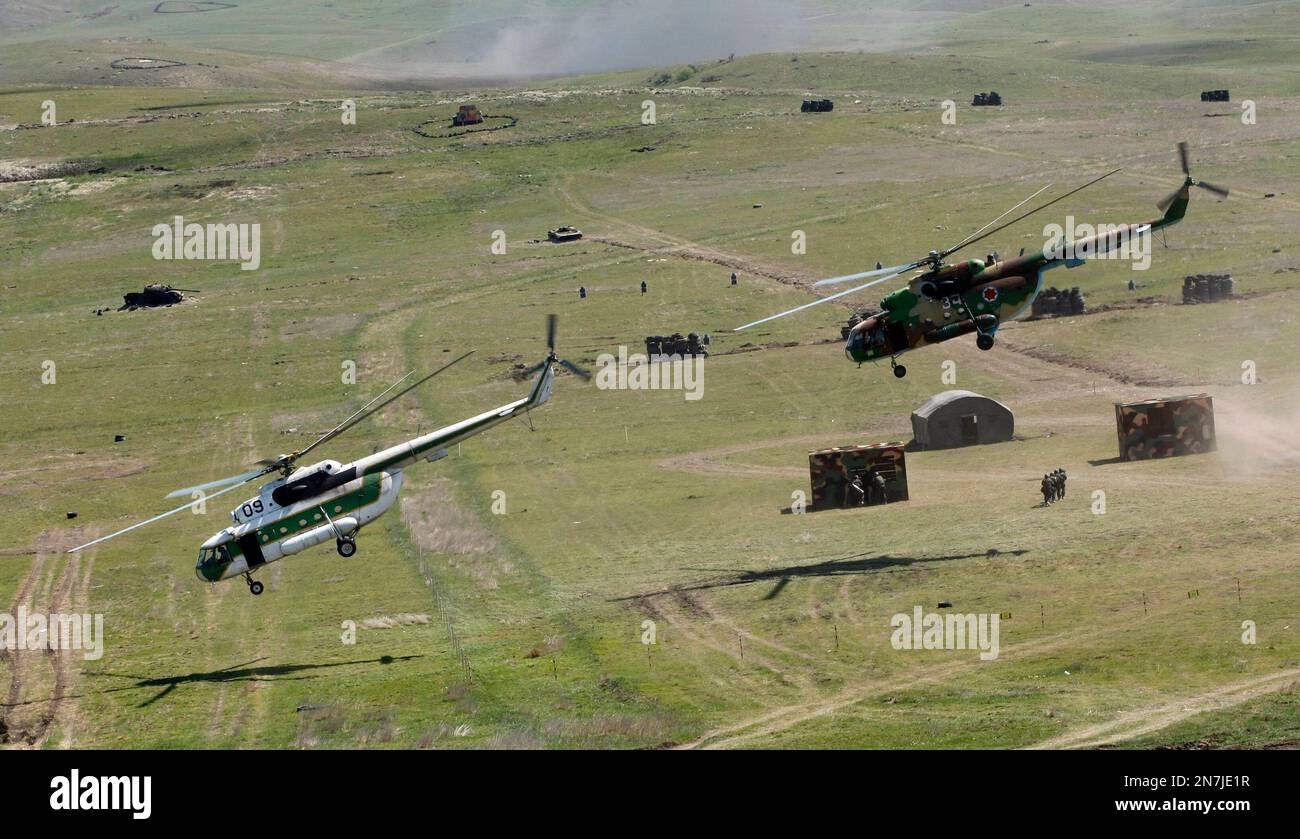 Georgian Army helicopters fly during a military drill to mark Georgian ...