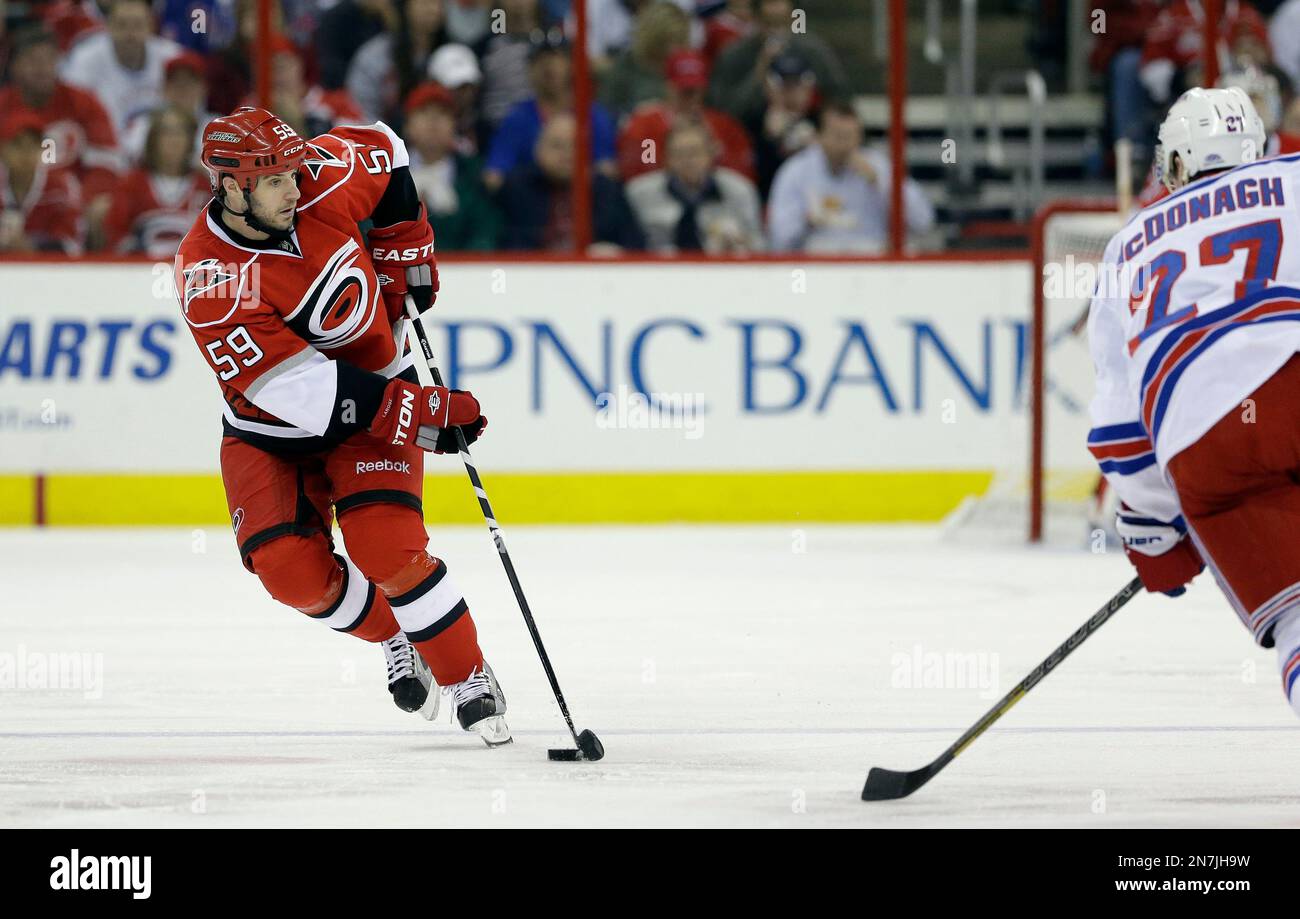 Carolina Hurricanes' Chad LaRose (59) controls the puck against the New ...