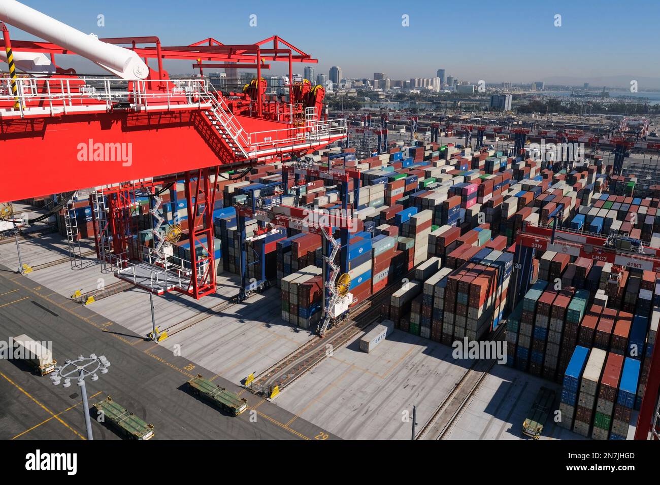 Stacked shipping containers wait to move by Automated Staking Cranes ...
