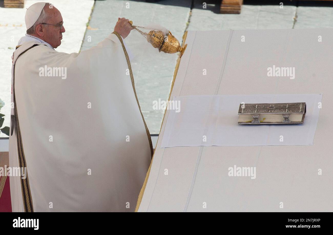 Pope Francis spreads incense as he arrives in St. Peter's Square to ...