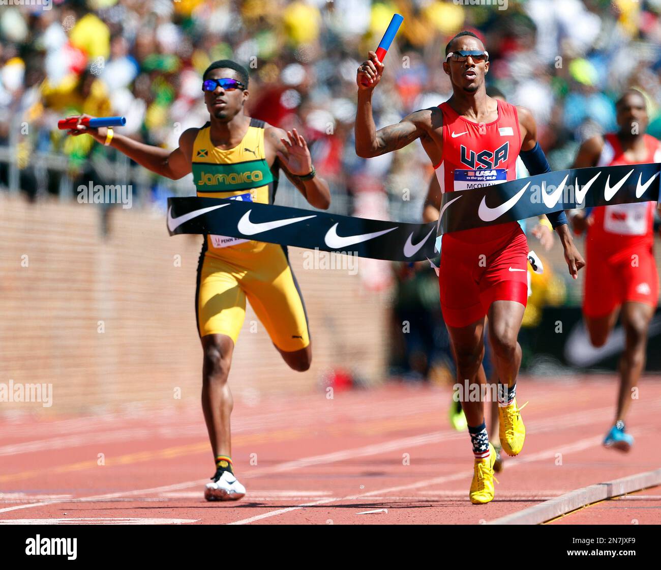 Tony McQua, right, of USA Red, edges out Errol Nolan of Jamaica, at the ...