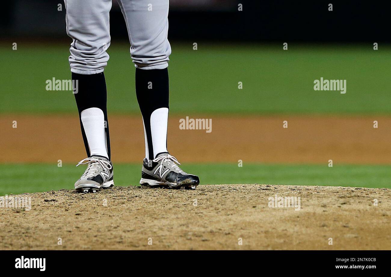 Colorado Rockies pitcher Josh Outman stands on the mound against the ...