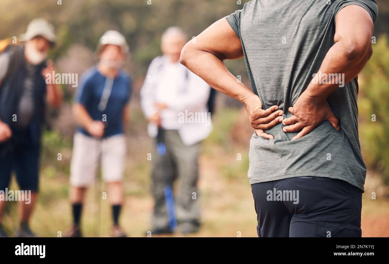 Man with back pain, exercise injury and outdoor hiking, spine and ...