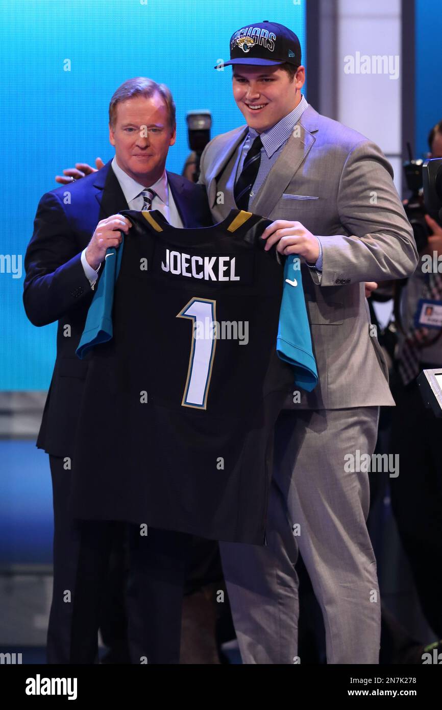 Luke Joeckel, from Texas A&M, stands with NFL Commissioner Roger ...