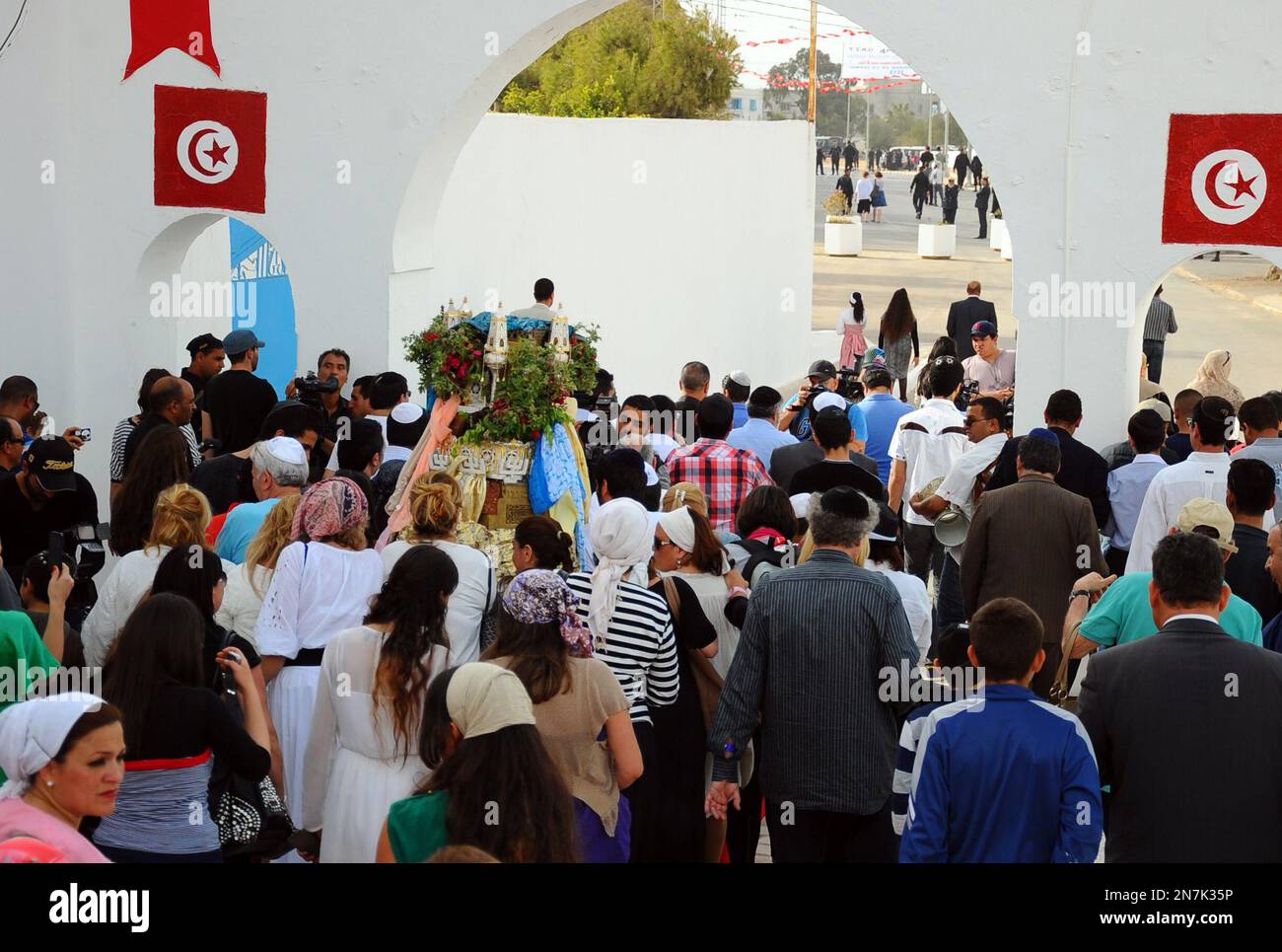 Jewish pilgrims are gathered for a procession at the Ghriba synagogue ...