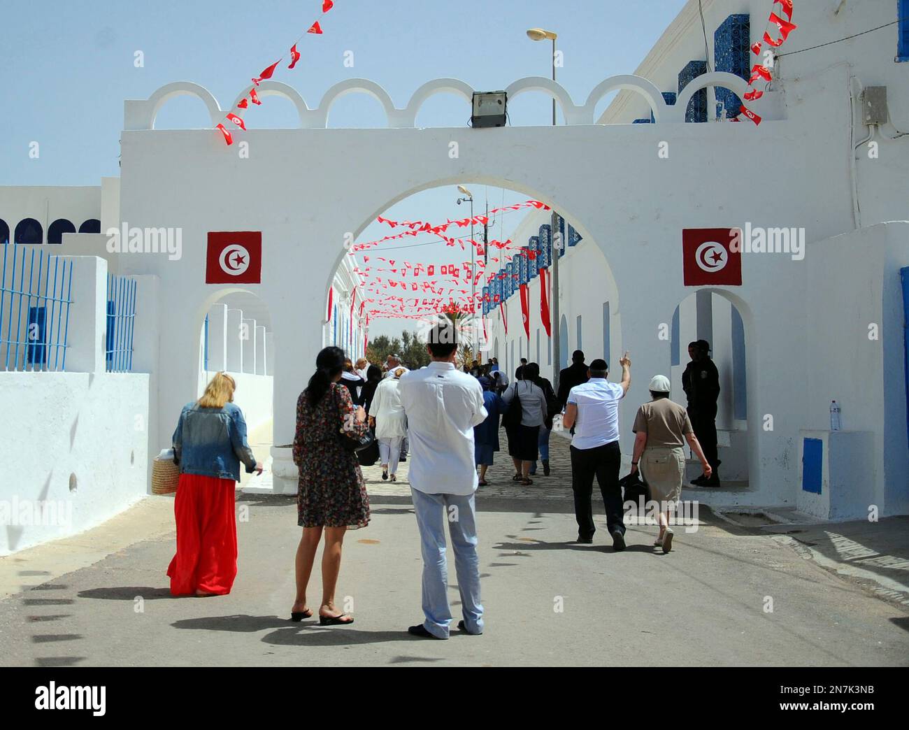 Jewish pilgrims are gathered at the entrance of the Ghriba synagogue ...