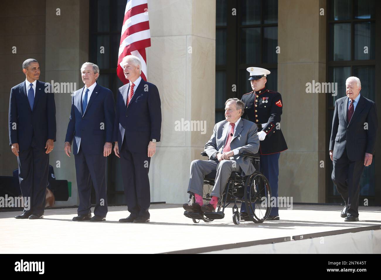 President Barack Obama stands with former presidents George W. Bush ...