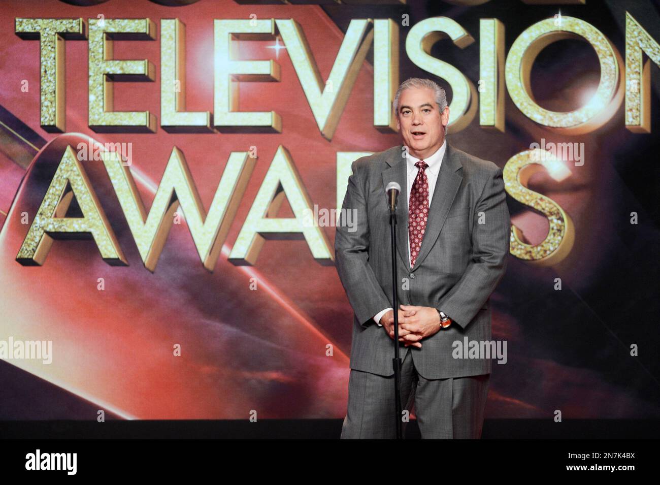 Andy Sale of Ernst & Young Presents a College Television Award onstage ...