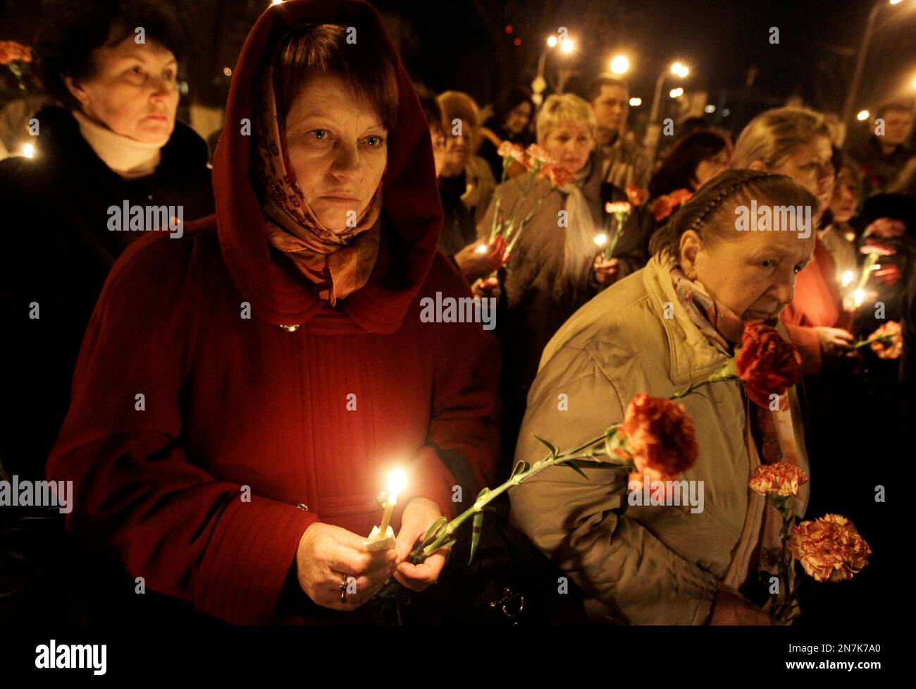 Ukrainians hold candles commemorating the anniversary of the Chernobyl ...