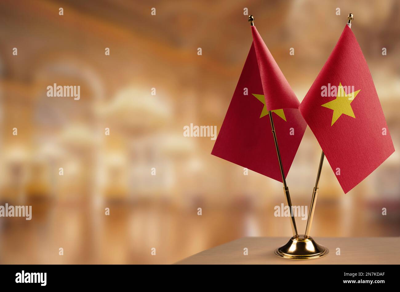 Small flags of the Vietnam on an abstract blurry background Stock Photo ...