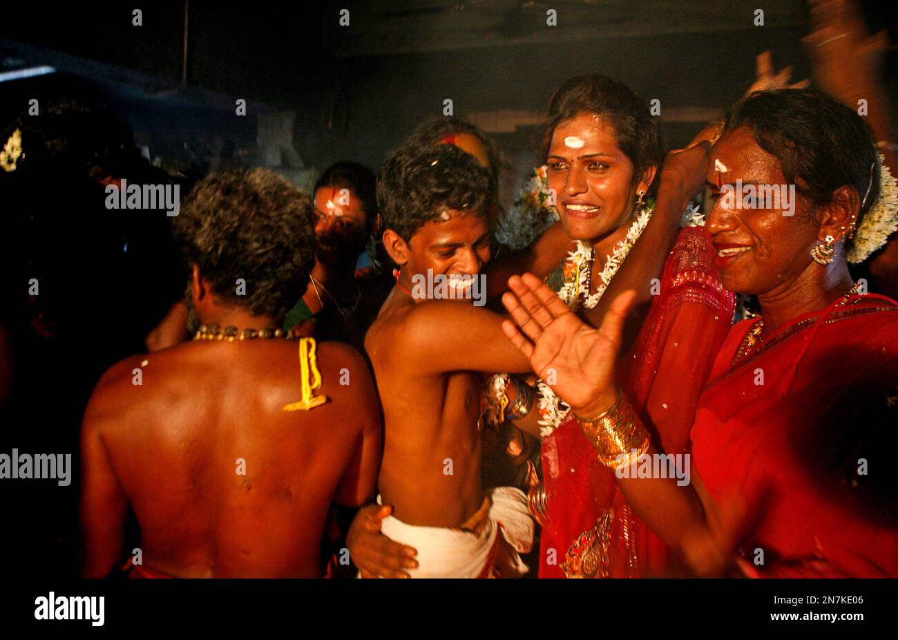 In this Tuesday, April 23, 2013 photo, a temple priest ties a holy ...