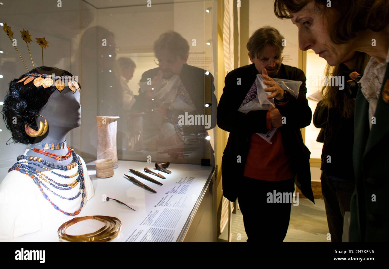 People look to a reconstructed head of a Sumerian woman during a media ...