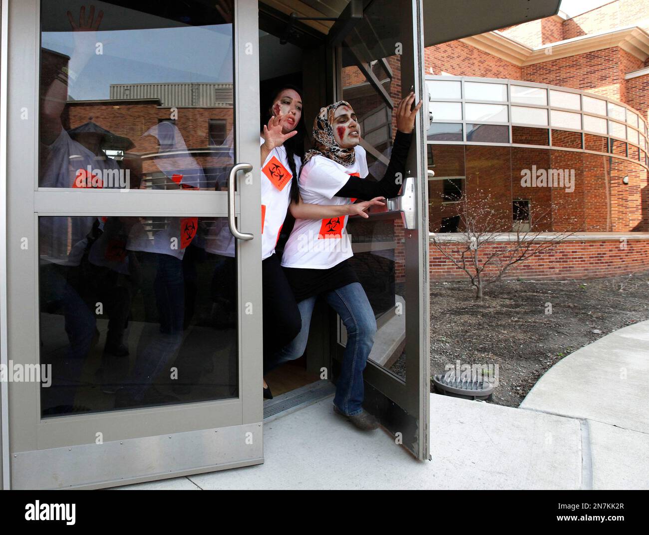 Students act during a "zombie apocalypse" exercise, which was to ...