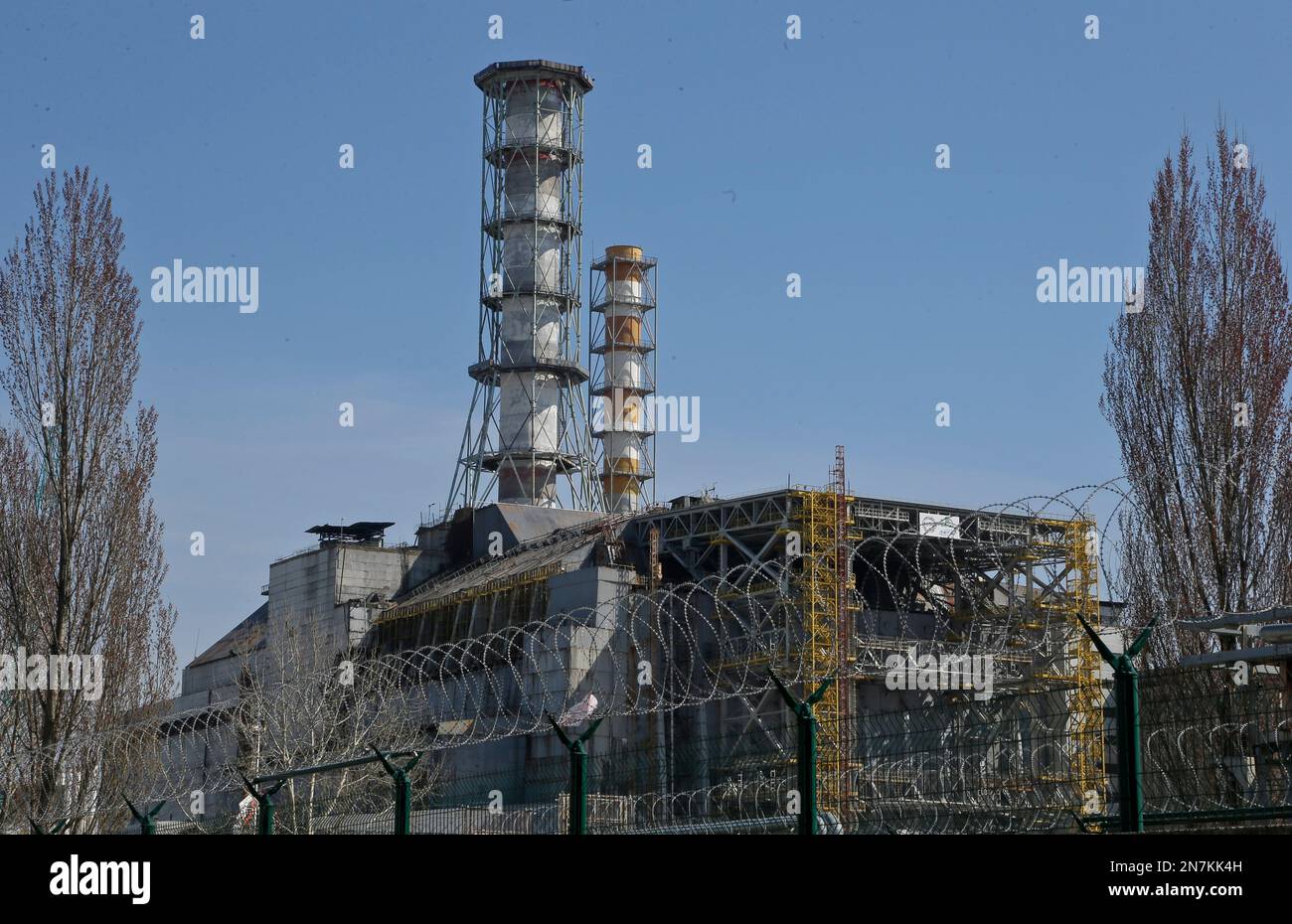 A chimney stands over the damaged reactor at the Chernobyl nuclear ...