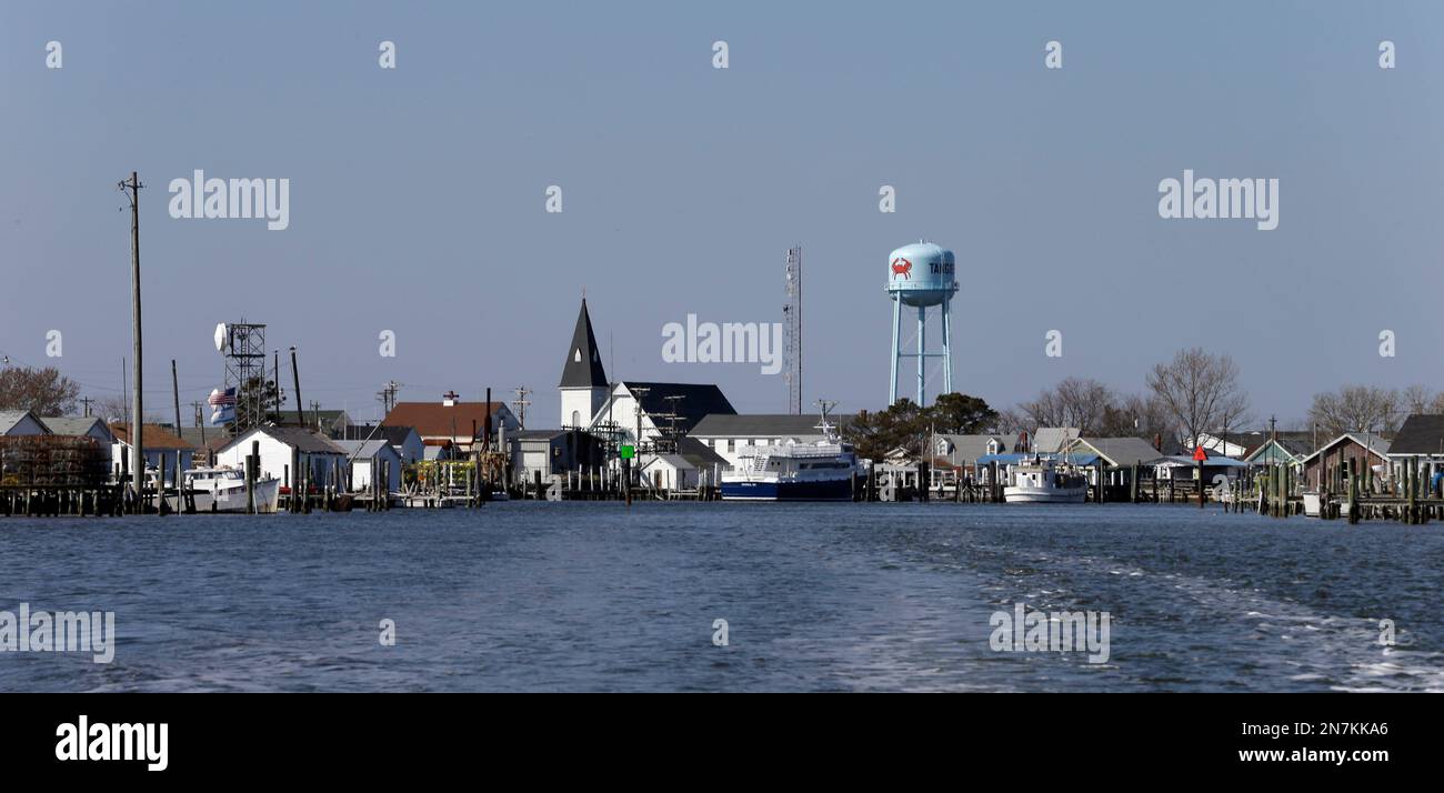 The Swain Memorial Church and a water tower rise above crab shacks on ...