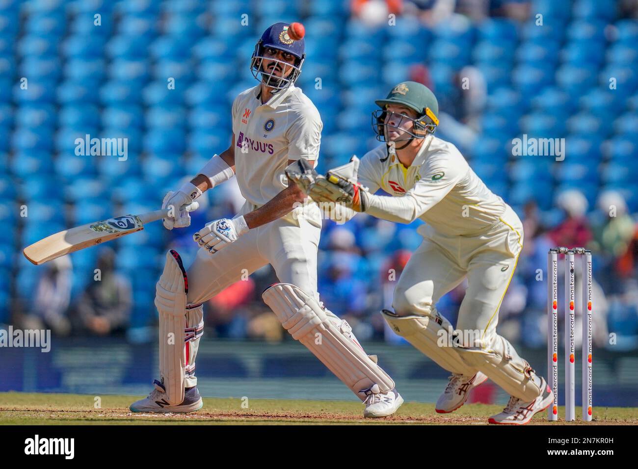 Australia's wicketkeeper Alex Carey, right, tries to catch out India's ...