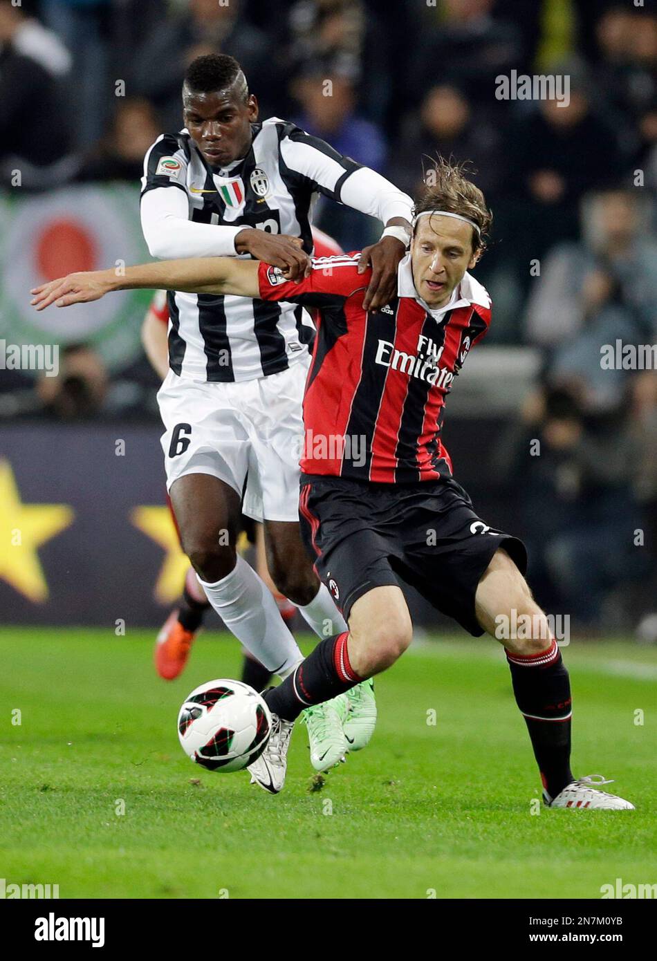 Juventus midfielder Paul Pogba, of France, left, challenges for the ...