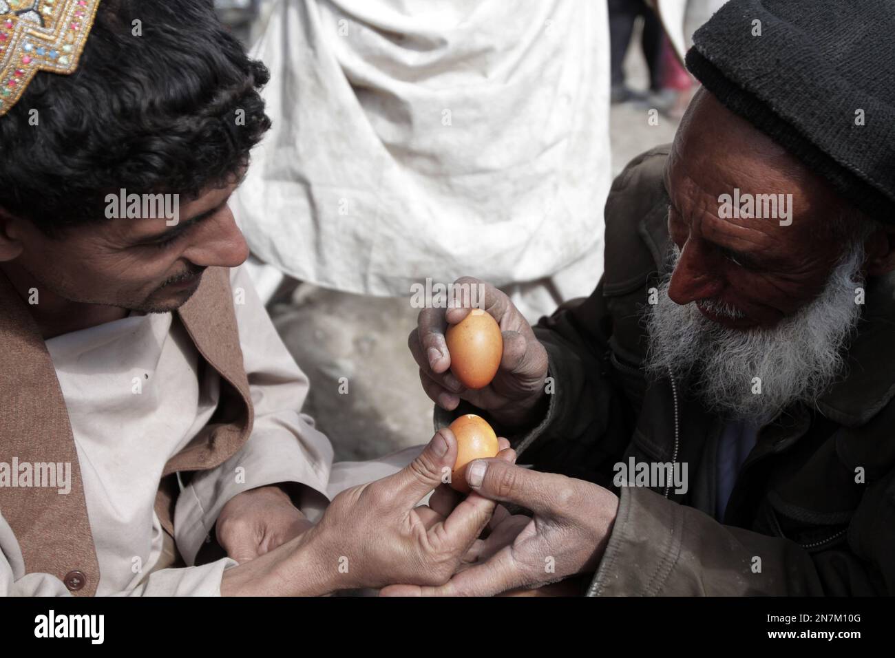 Afghan men participate in egg fighting with boiled eggs on the ...