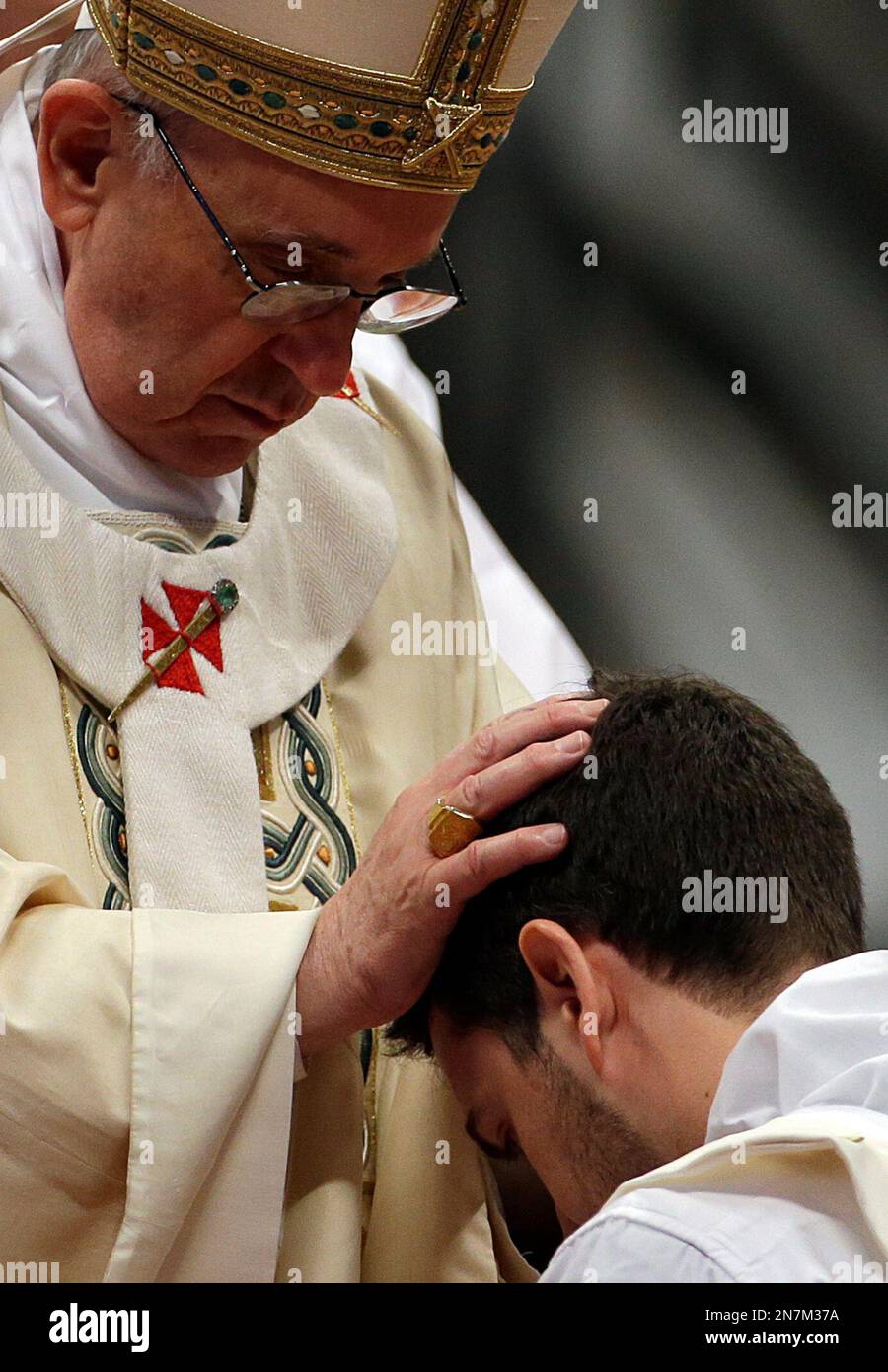 Pope Francis blesses a newly ordained priest during a ceremony in St ...