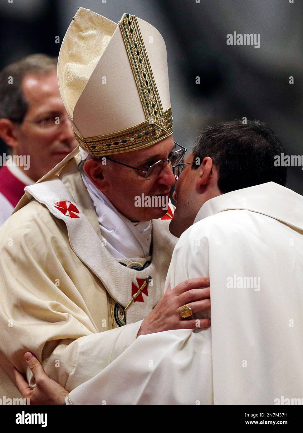 Pope Francis hugs a newly ordained priest during a ceremony in St ...