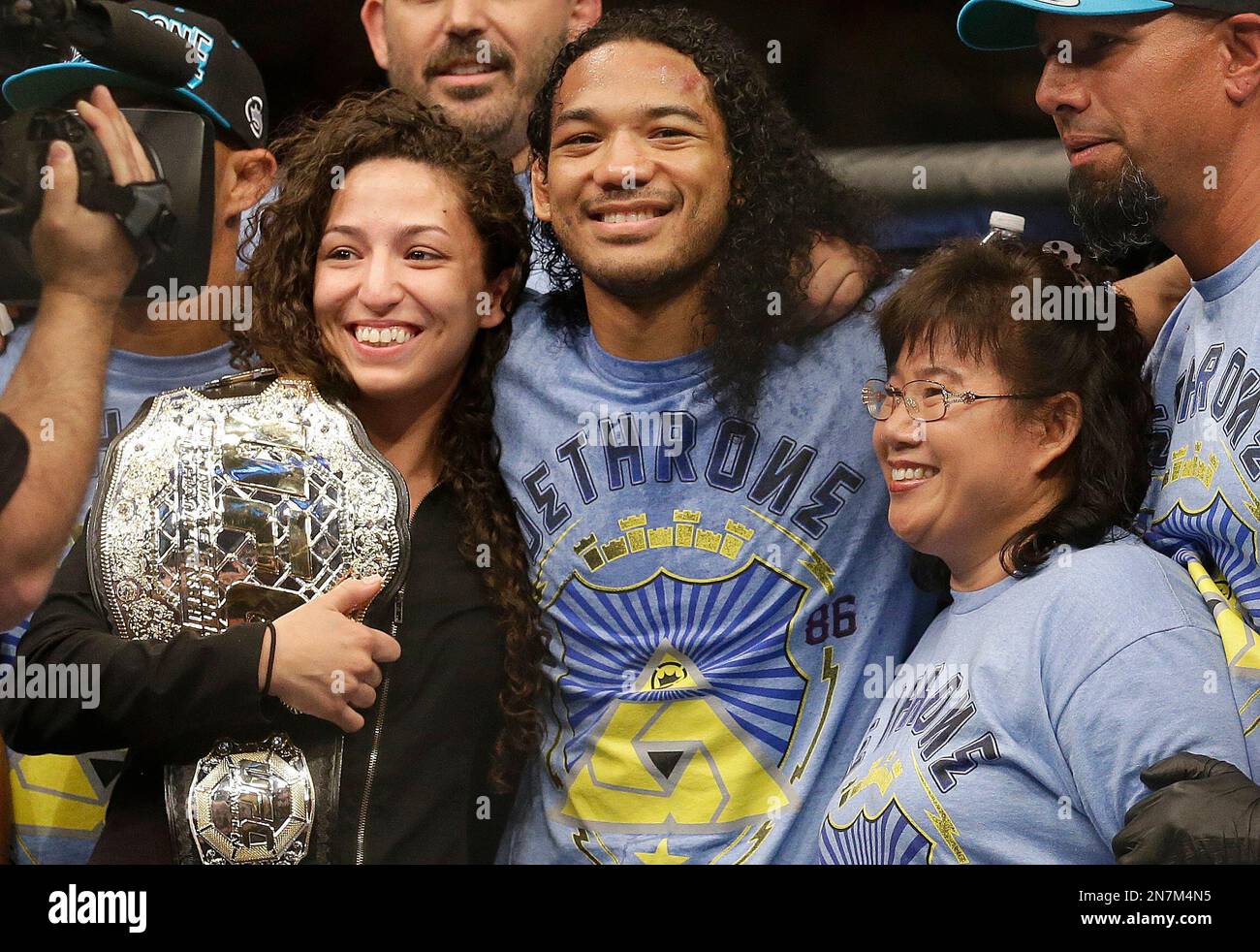 Benson Henderson, center, celebrates with his finacee, Maria Magana ...