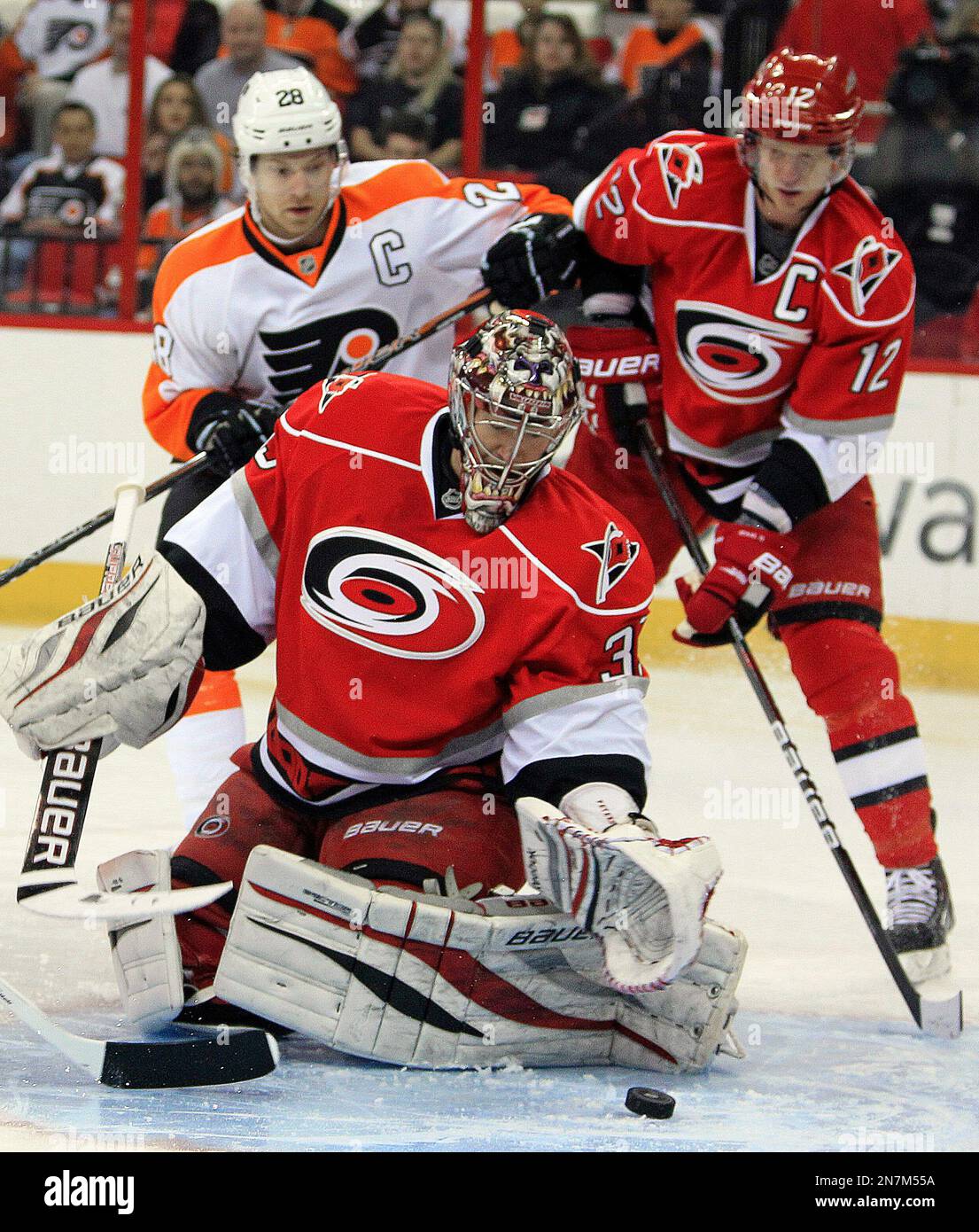 Carolina Hurricanes goalie Justin Peters (35) eyes the puck moving ...