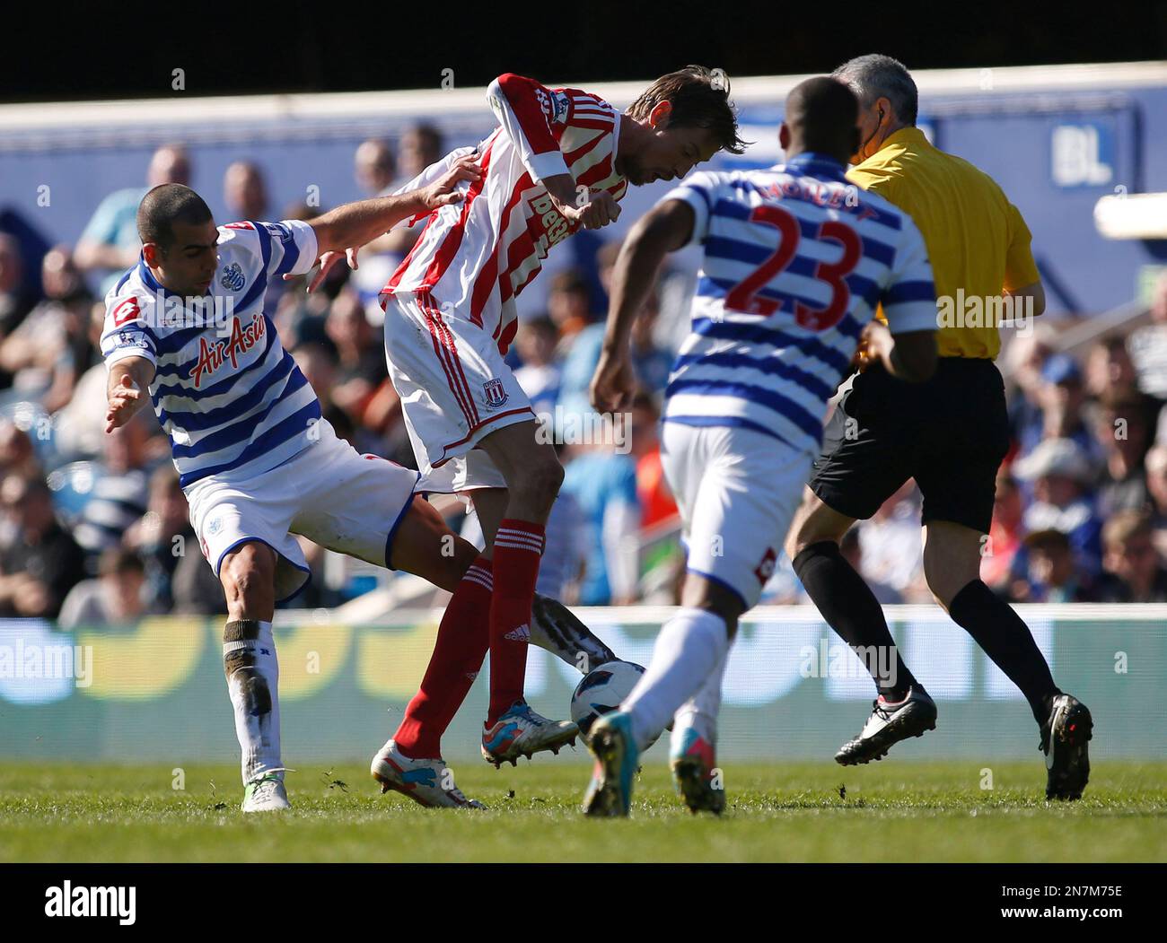 Queens Park Rangers' Tal Ben Haim, left, competes with Stoke City's ...