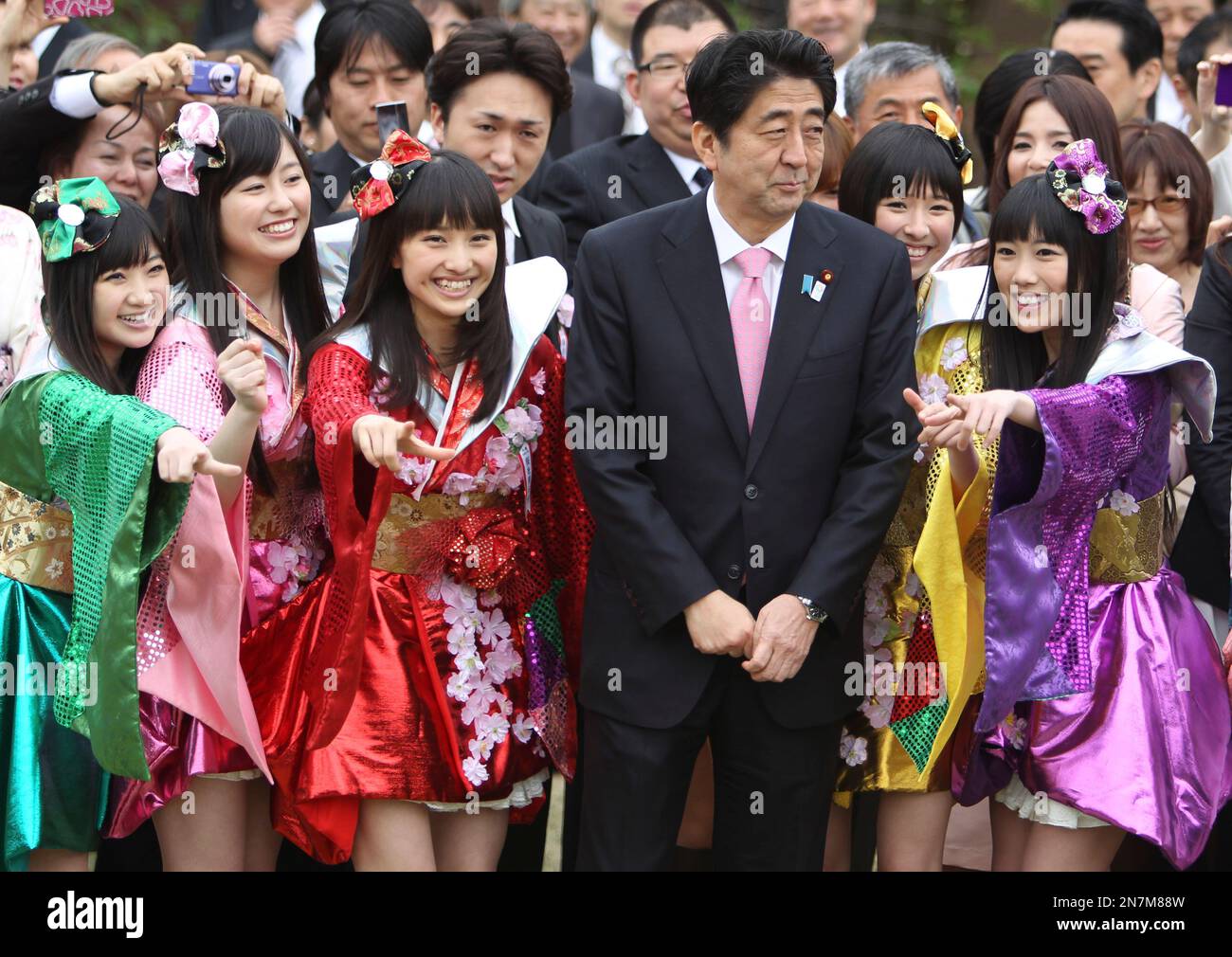 Japan's Prime Minister Shinzo Abe, third right, poses with members of ...