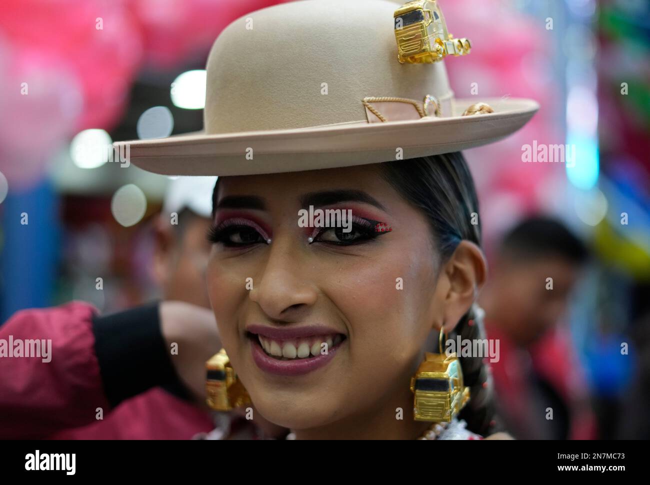 A Chola contestant smiles during a competition to elect the three main ...