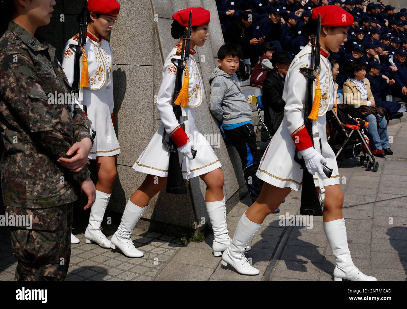 Female honor guards walk for an honor guard ceremony to perform before ...