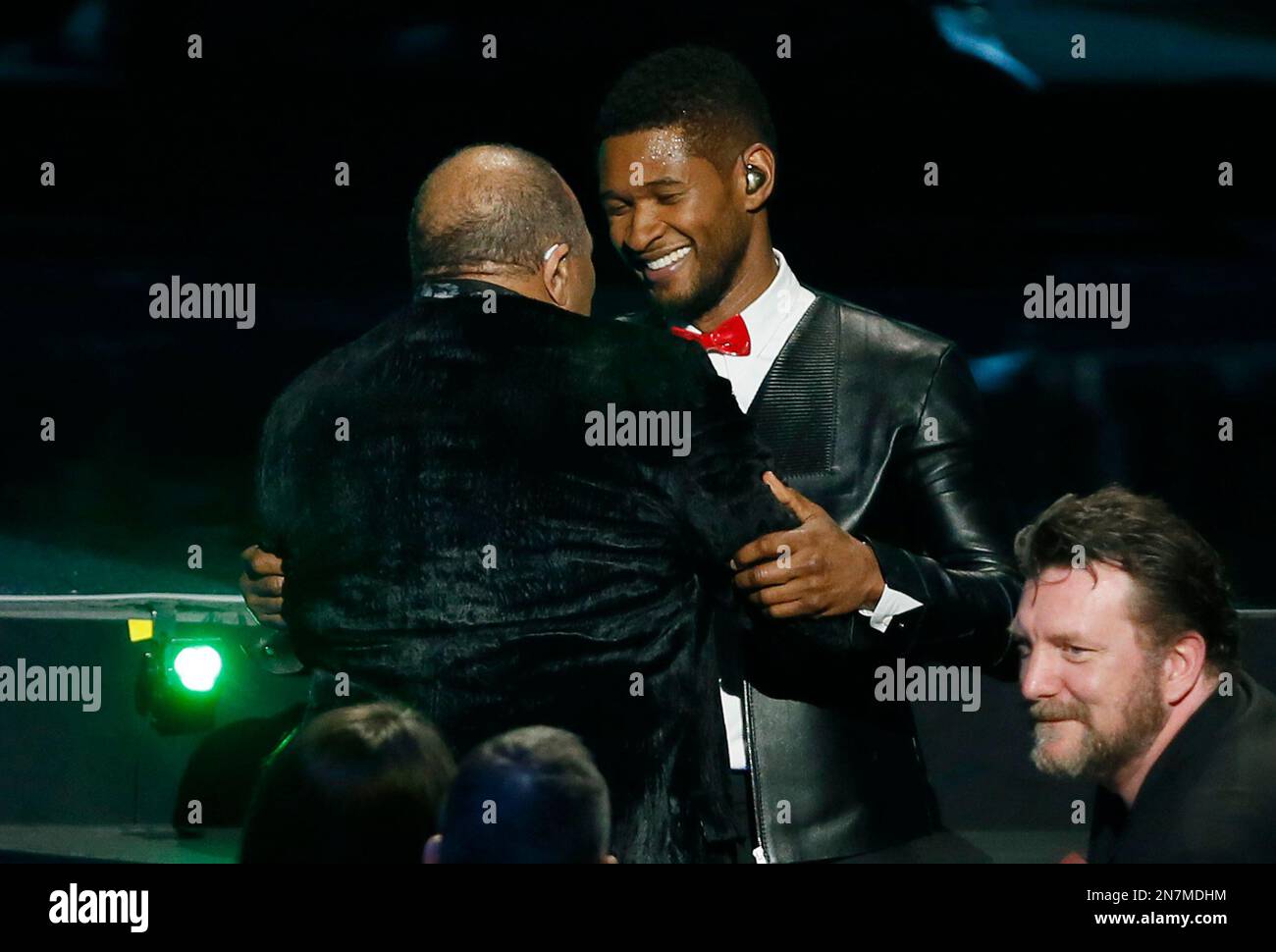 Usher hugs producer Quincy Jones as Jones is inducted into the Rock and ...