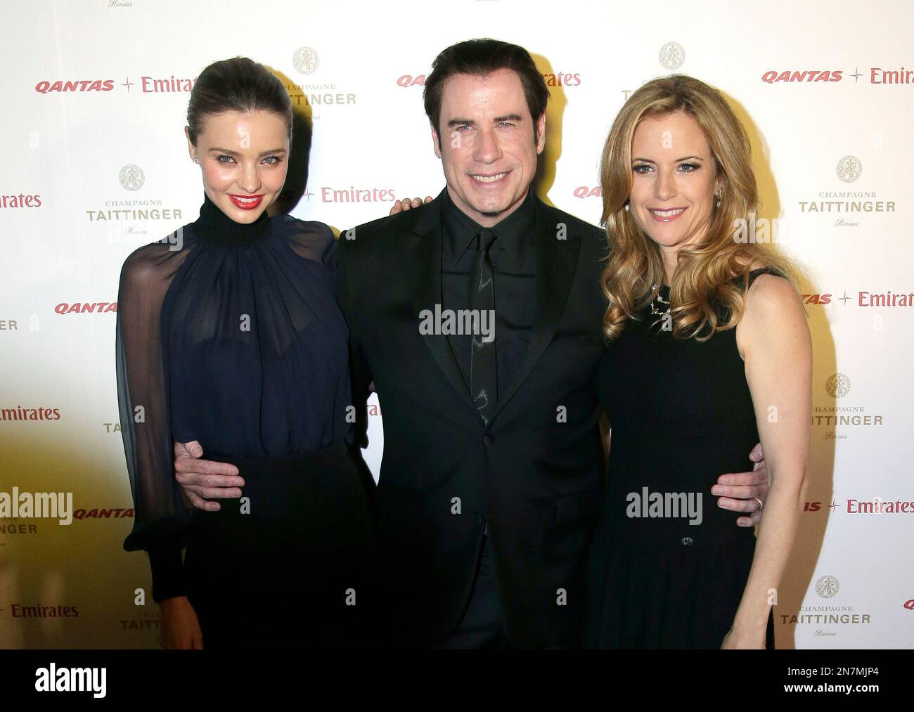 Actor and Qantas ambassador John Travolta center, with wife Kelly ...